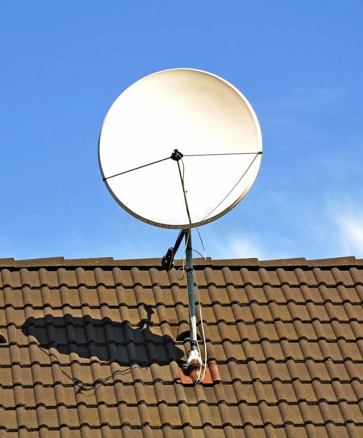 Satellite dish on the roof stock photo. Image of built - 59495140