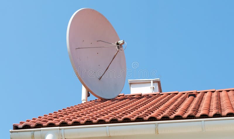 Satellite dish on the roof stock photo. Image of satellite - 77431918