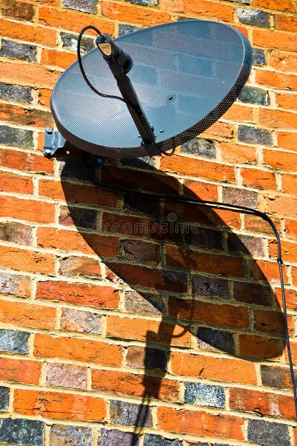Satellite Dish and Shadow stock photo. Image of brick - 8440454