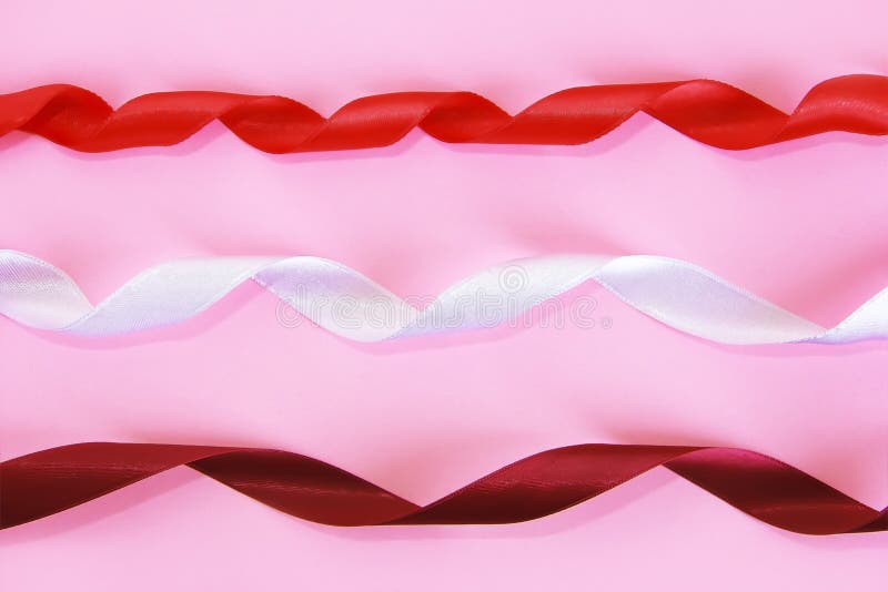 Satin Decorative White, Red, Maroon Ribbon on a Pink Background Stock ...