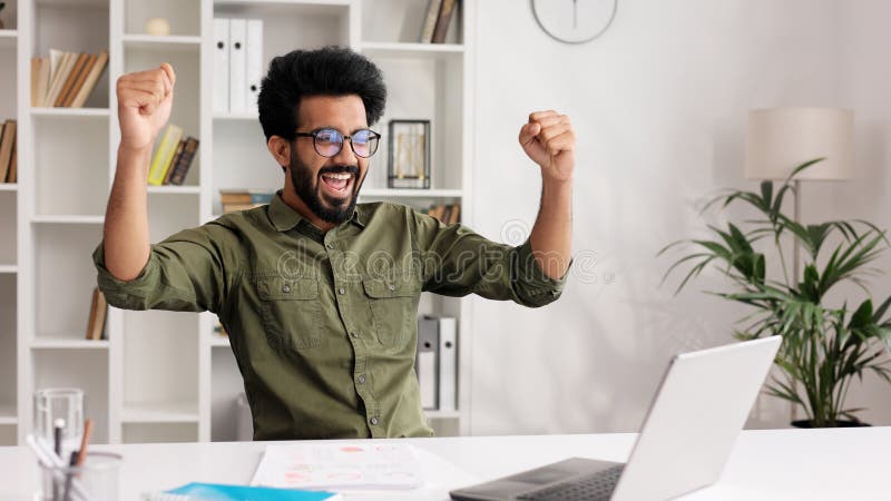 Satisfied Indian Man In Black Glasses Checking His Email And Happy With