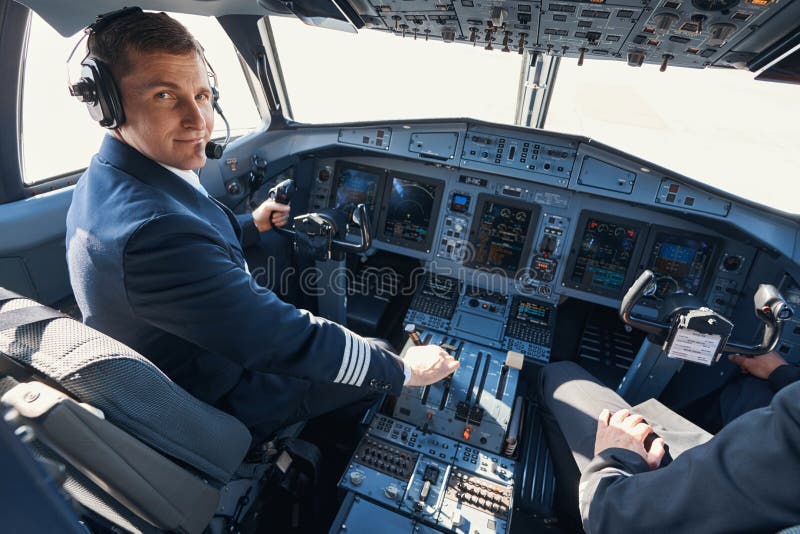 Pleased Aircraft Captain Smiling while Pulling Thrust Lever Stock Image ...
