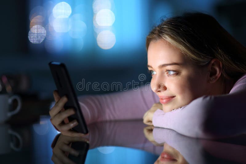 Satisfied Teen Watching Phone Content in the Night at Home Stock Image ...