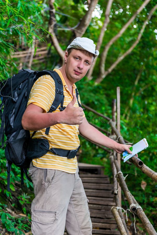 A Satisfied Tourist with a Backpack and Map Stock Image - Image of park ...