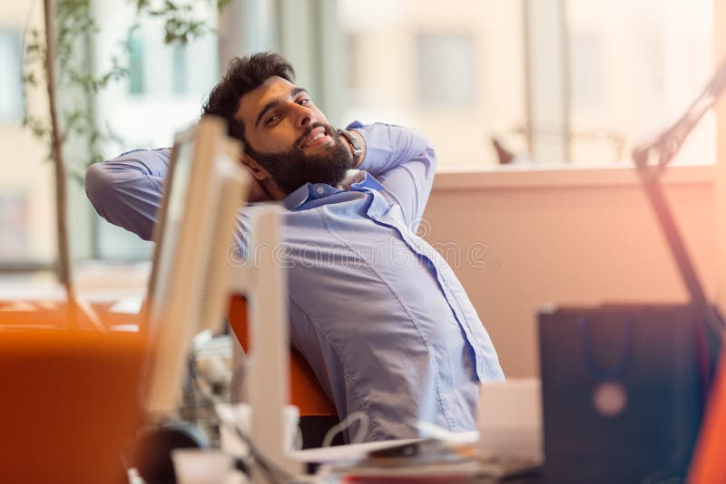 Satisfied with Work Done. Happy Young Man Working on Laptop while ...