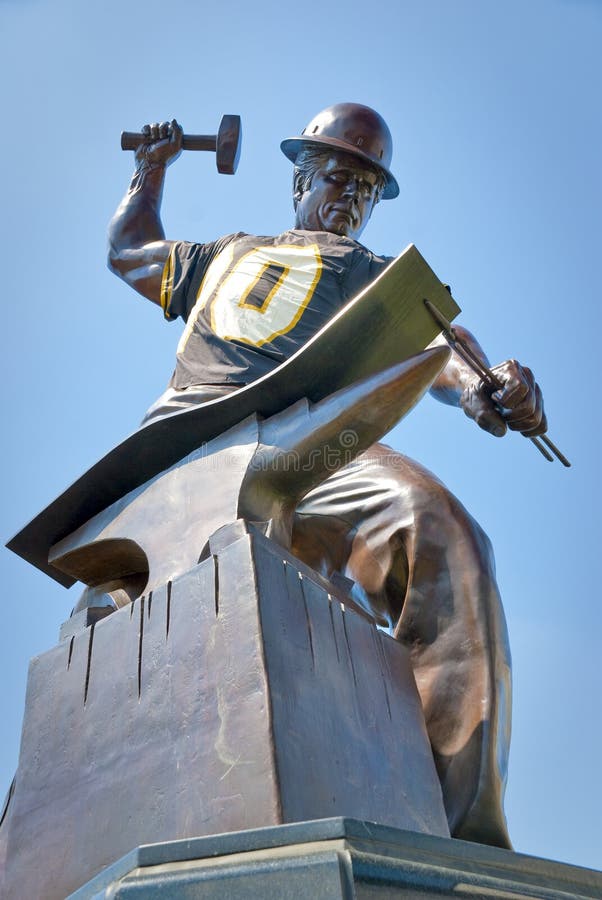 Satue of a Steel Worker Against a Blue Sky Stock Photo - Image of blue ...