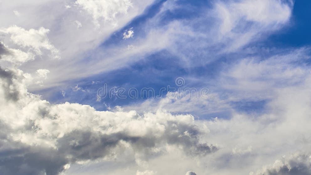 Saturated Blue Sky with Partial Clound Coverage for Backgrounds and ...