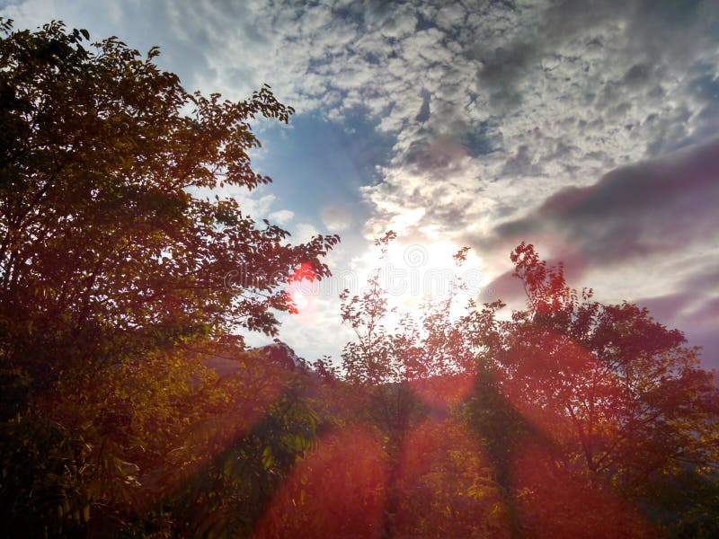 Saturated with clouds sky stock image. Image of rock - 76576953