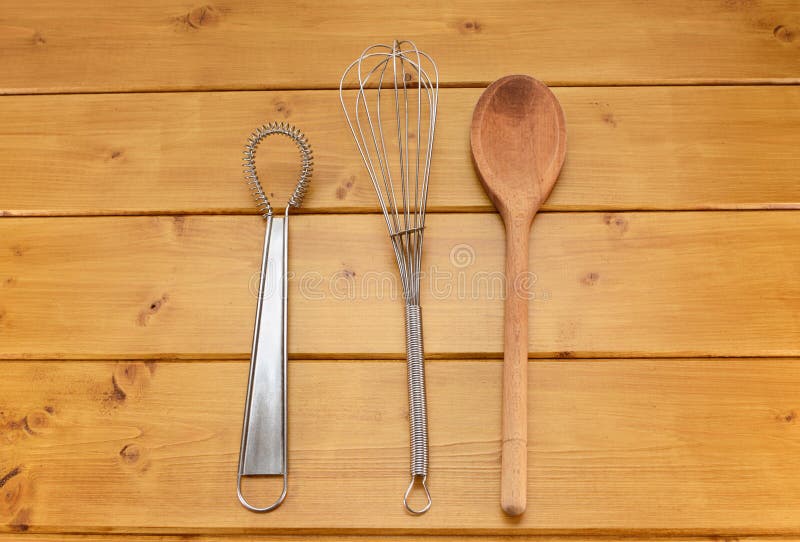 Sauce and Balloon Whisks and Wooden Spoon Stock Photo - Image of ...