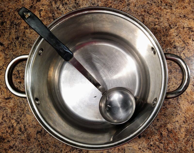 Saucepan with Kitchen Scoop on Kitchen Table Stock Photo - Image of ...