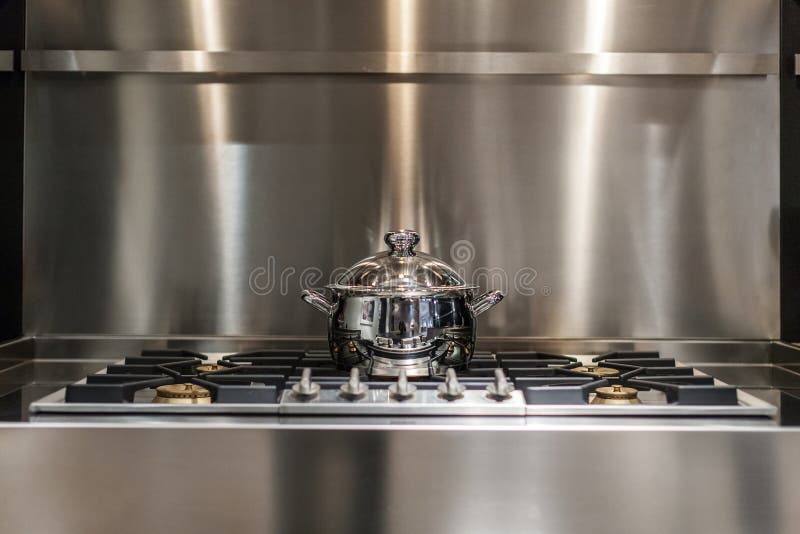 Saucepan on stove stock image. Image of metal, appliance - 117158423