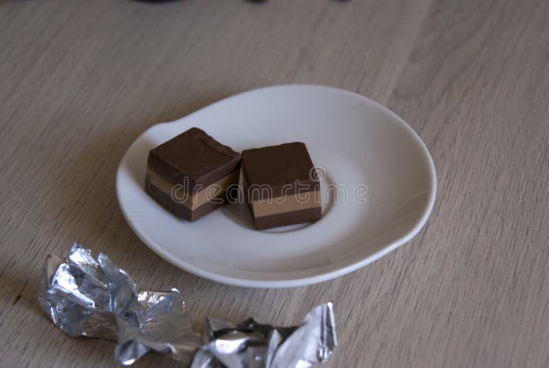 Saucer with two chocolates stock photo. Image of cocoa - 59506310