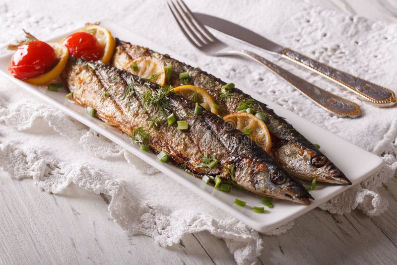 Saury Grilled with Vegetables on a Plate. Horizontal Stock Photo ...