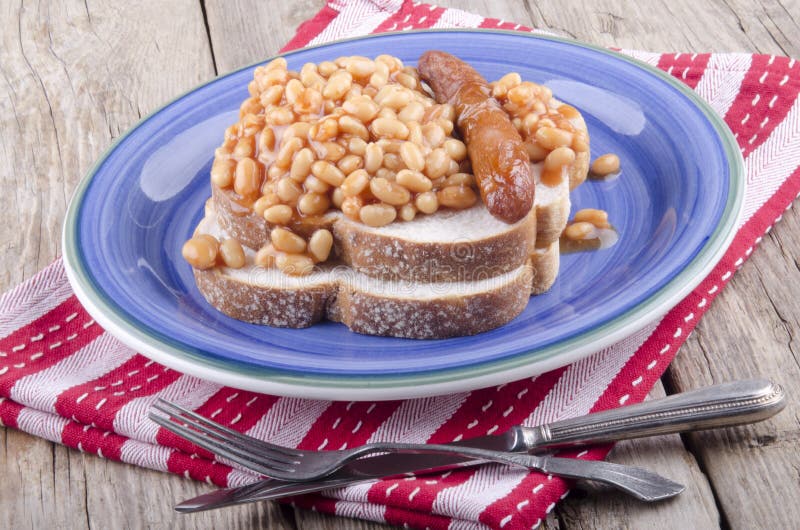 Sausage with Baked Beans on Bread Stock Photo - Image of knife, snack ...