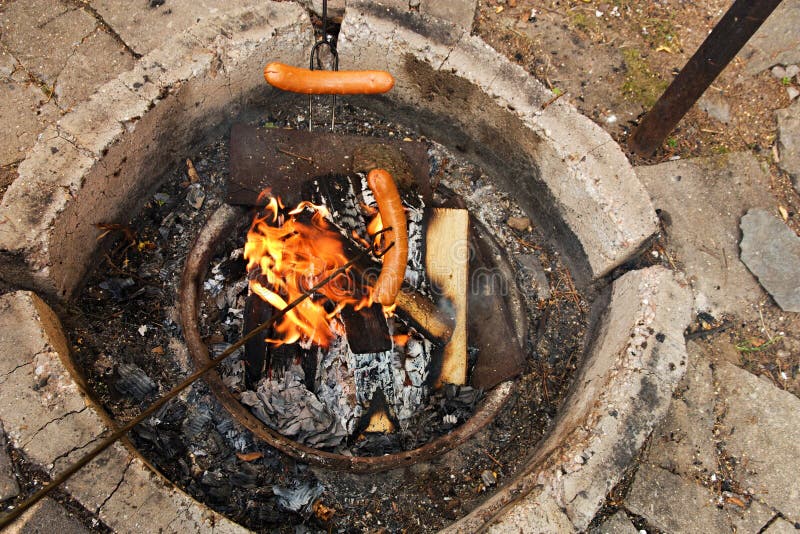 Sausage in fire stock photo. Image of stick, embers, campfire - 42934344