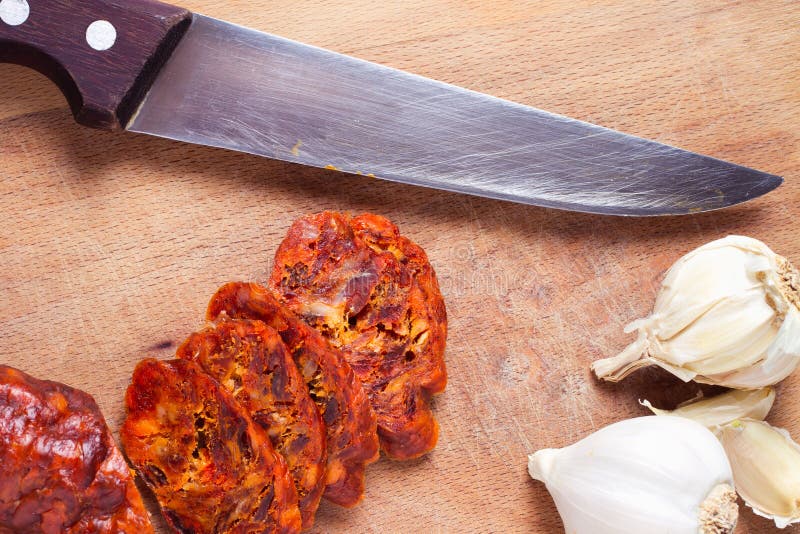 Sausage, garlic and knife stock image. Image of sausage - 24063113