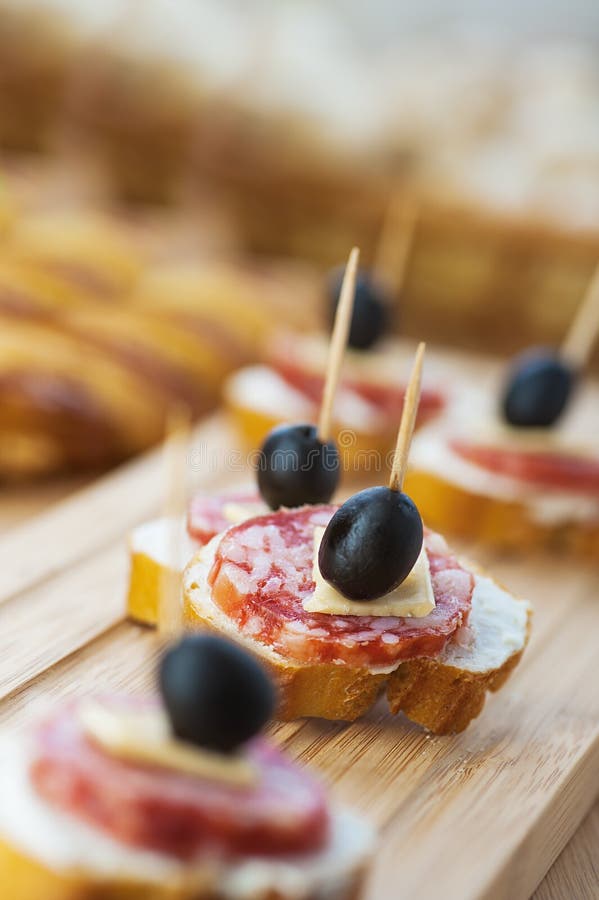 Making Pintxo with Tomato and Sausages, Tapas, Spanish Canapes Party ...
