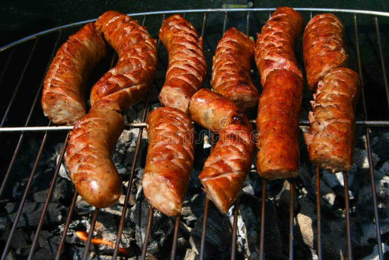 Sausages on a barbecue stock photo. Image of picnic, backyard - 4481484