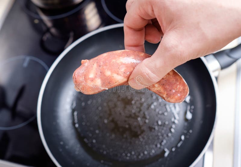 Sausages cooking stock image. Image of heat, housework - 69251969
