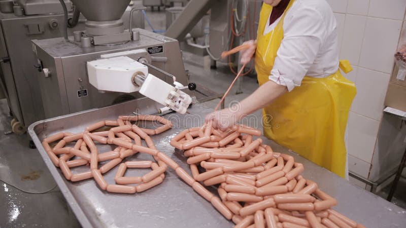 Sausages Production. Butcher Making Meat Delicacy on a Automated Meat ...