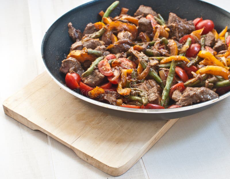 Sauted meat and vegetables stock photo. Image of iron - 24496306