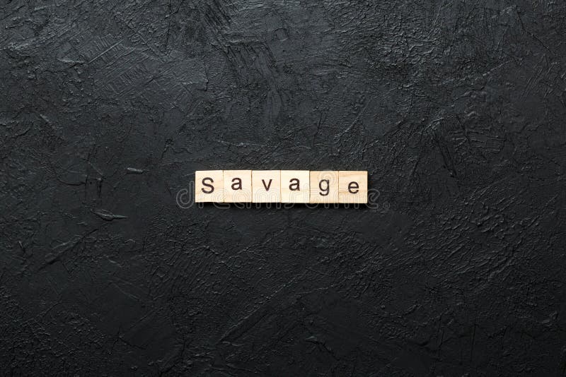 SAVAGE Word Written on Wood Block. SAVAGE Text on Cement Table for Your ...