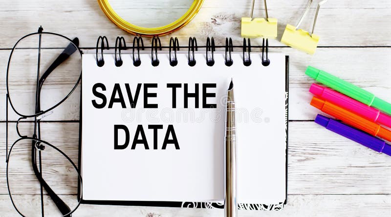 SAVE the DATA Written in a Notebook on White Background with Office ...