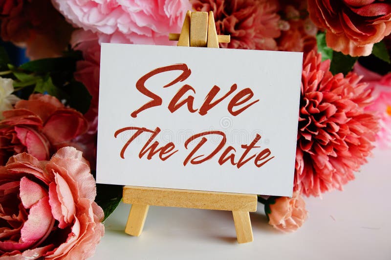 Save the Date Text Write on Paper Card with Wooden Easel and Flowers ...