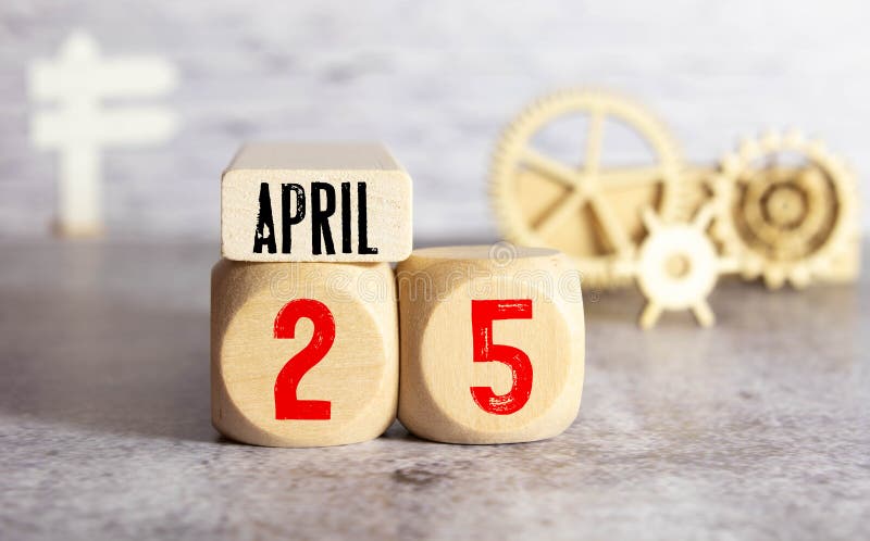 Save the Date Written on a Calendar - April 25 on Wooden Block Stock ...