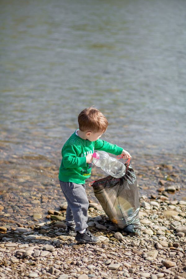 Save Environment Concept, a Little Boy Collecting Garbage and Plastic ...