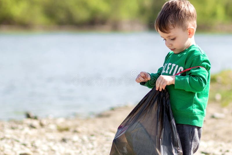 Save Environment Concept, a Little Boy Collecting Garbage and Plastic ...