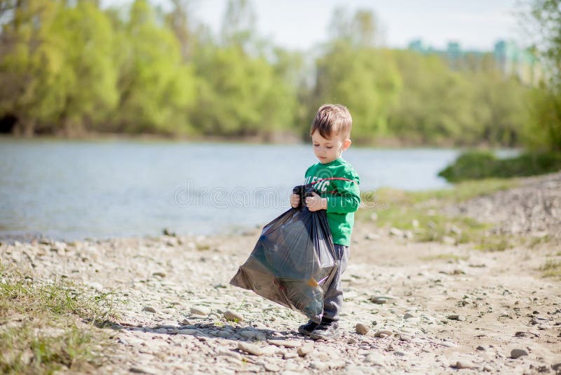 Save Environment Concept, a Little Boy Collecting Garbage and Plastic ...