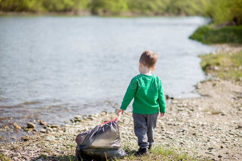 Save Environment Concept, a Little Boy Collecting Garbage and Plastic ...