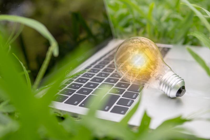 Save Power and Good Energy for Nature Concept ,light Bulb on Laptop in ...