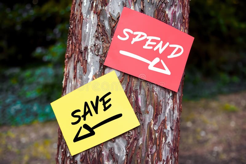 Save and Spend Words Written on Papers on a Tree with Arrow Signs ...