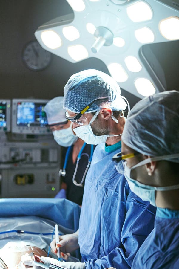 Saving Lives is Top Priority. Surgeons in an Operating Room. Stock ...