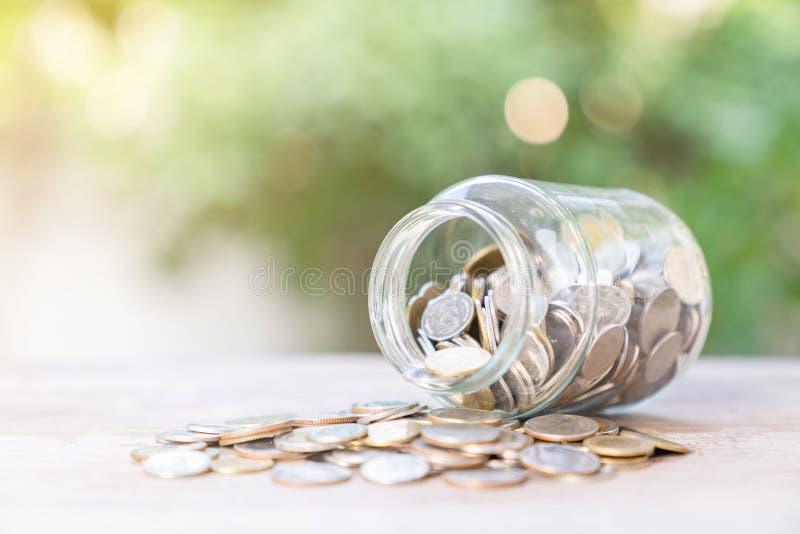 Saving Money Coins in Jug Glass Stock Photo - Image of business ...