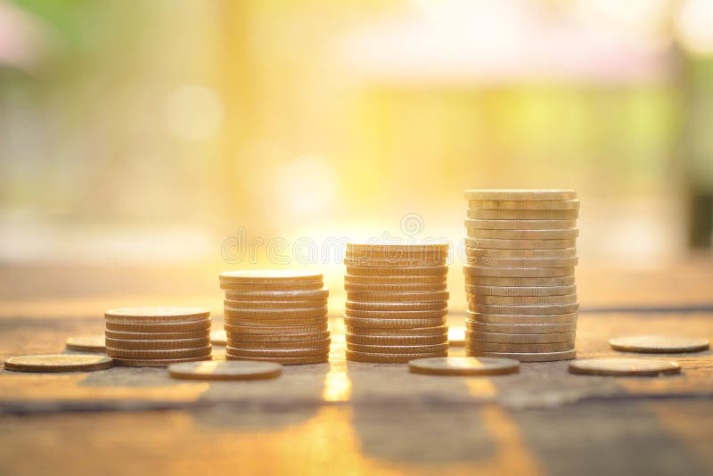 Saving Money Concept with Coin Stack Growing Business on Sunset ...