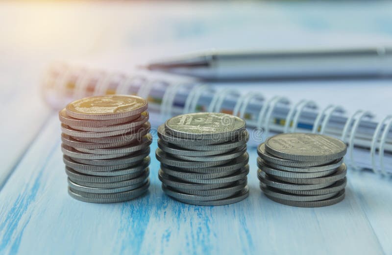 Saving Money Concept with Money Coin Stack Growing and Note Book Stock ...