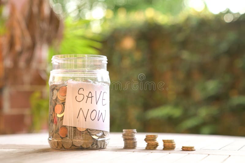 Saving Money Concept : Coins in Container and Stacked on Table Stock ... Saving Money Concept : Coins in Container and Stacked on Table Stock ...