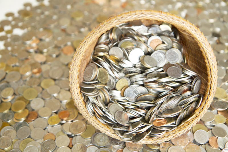 Saving Money Concept of Collecting Coins in a Basket with Coins ... Saving Money Concept of Collecting Coins in a Basket with Coins ...