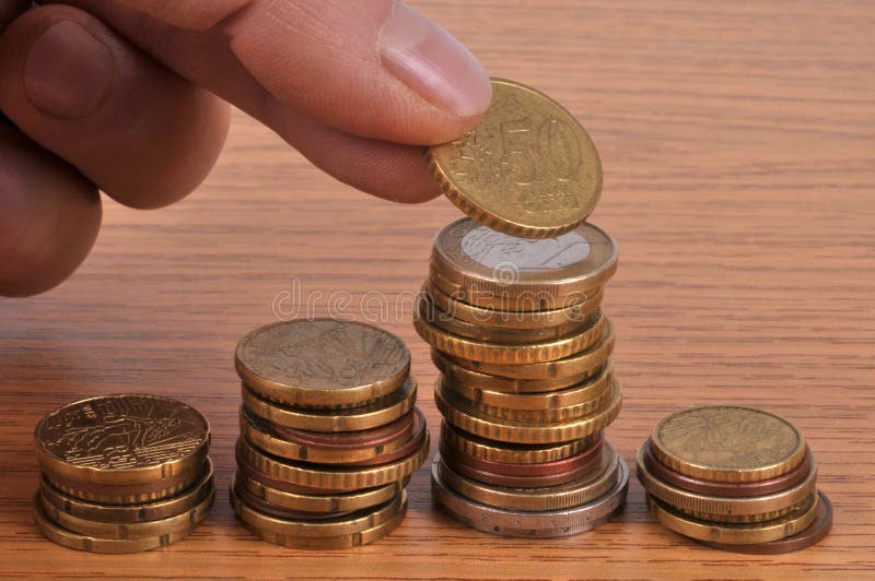Stacking coins in close up stock photo. Image of success - 161430282