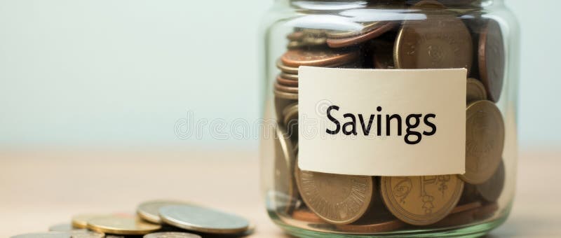 Savings â€“ a Jar Filled with Coins and a Label Showing the Importance ...