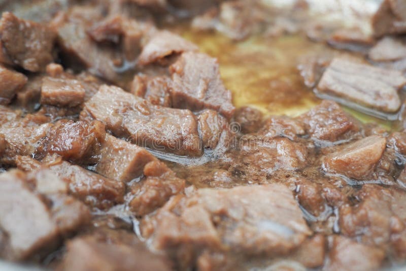 Savory Beef Cooking in a Pan Over Moderate Heat in a Kitchen Setting ...