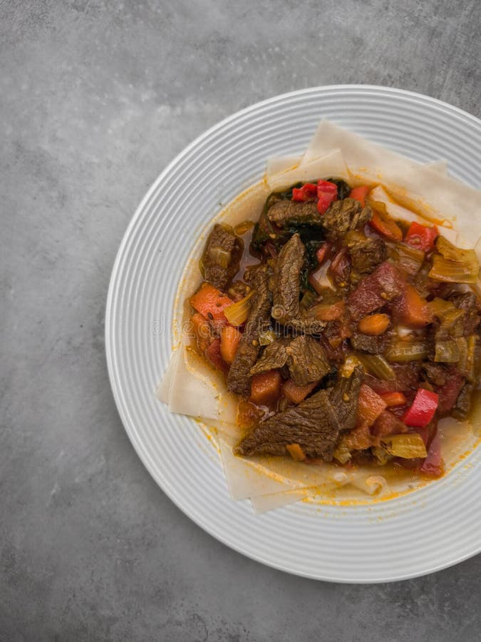 Savory Beef Stew with Injera Flatbread, Creating a Vibrant and ...