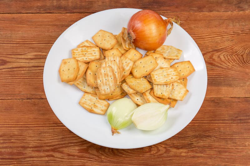 Savory Crackers with Onion Addition and Fresh Onion on Dish Stock Image ...