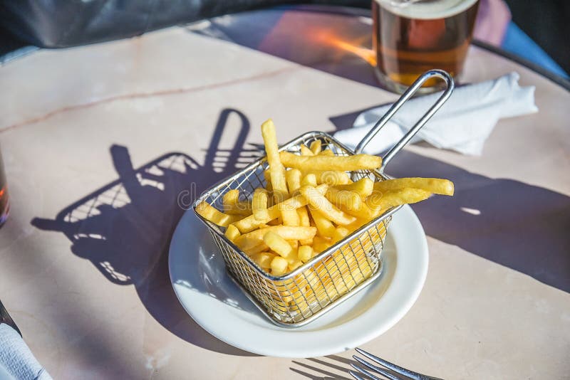 Savory French fries stock image. Image of fork, outdoors - 142871071