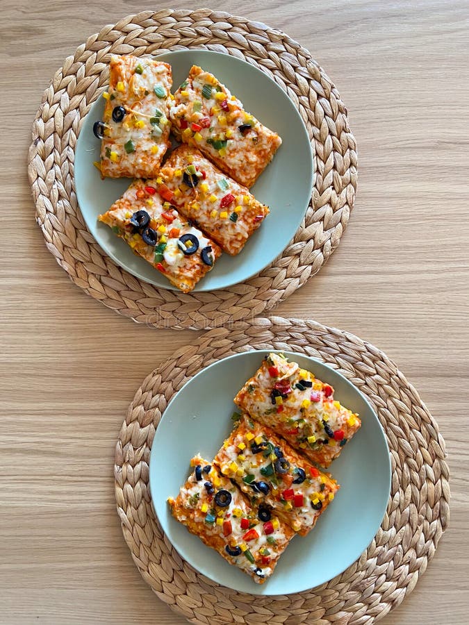 Savory Rectangular Pizzas Topped with Colorful Vegetables and Olives ...