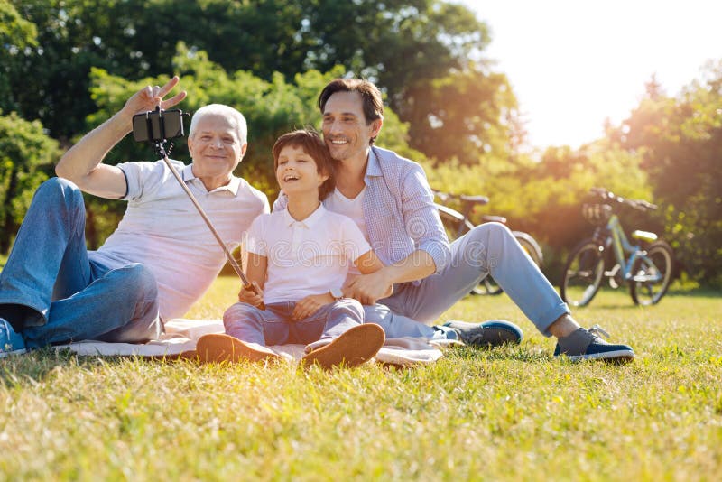 Savvy Curious Boy Using Smartphone for a Picture Stock Photo - Image of ...