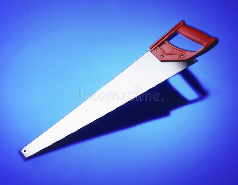 Saw on blue background stock photo. Image of sharp, craftsman - 96900728